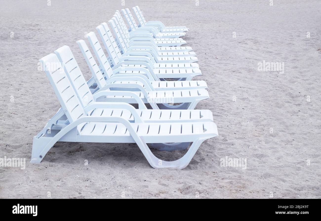 Sunbeds on sea beach in resort Stock Photo - Alamy