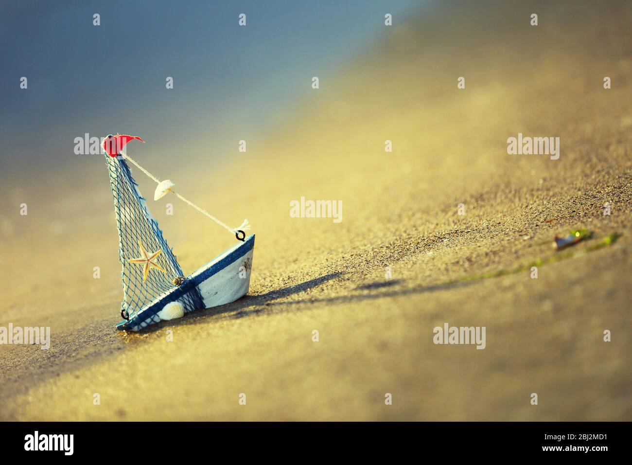 A little boat on the seashore Stock Photo - Alamy