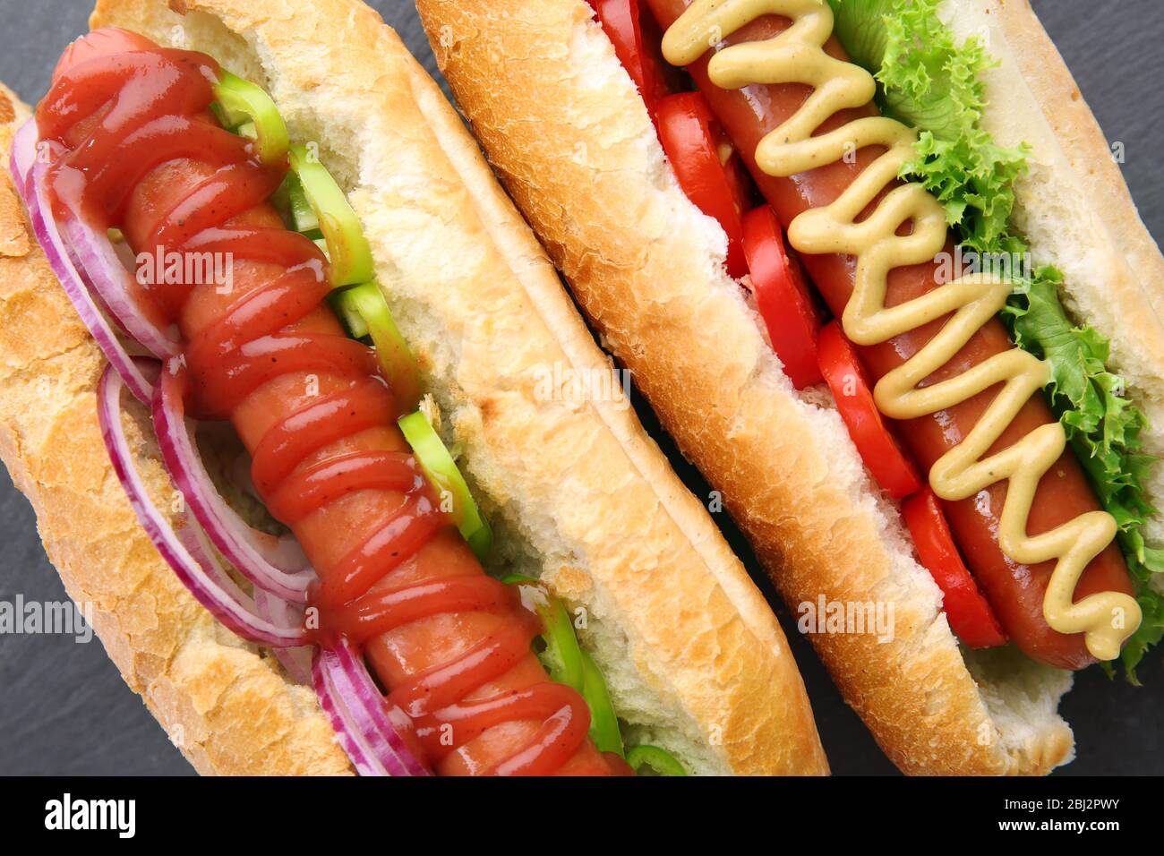 Fresh hot dog on dark grey background closeup Stock Photo - Alamy