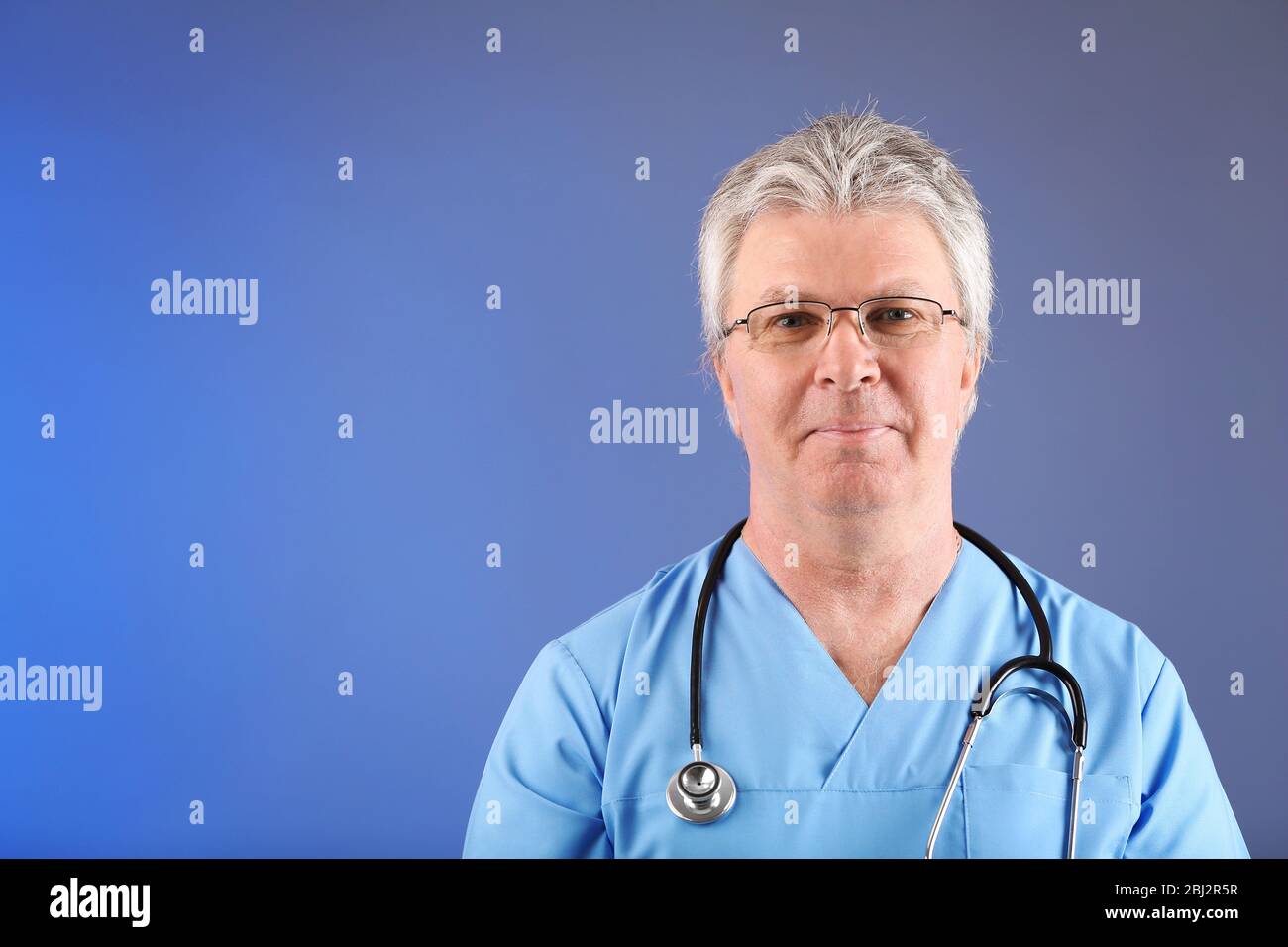 Doctor with stethoscope on colorful background Stock Photo - Alamy