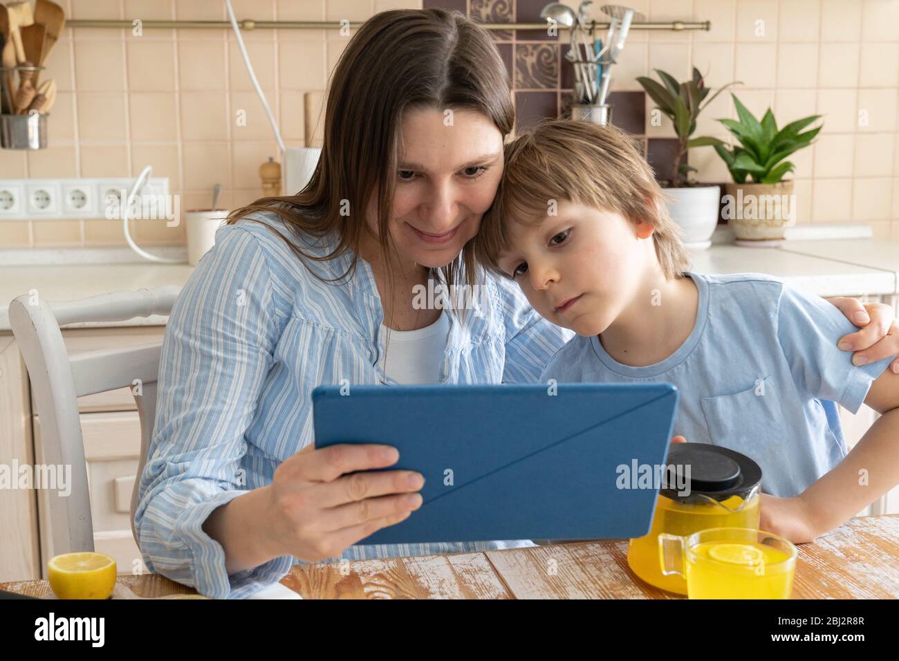 Mother and son make video call from home Stock Photo - Alamy