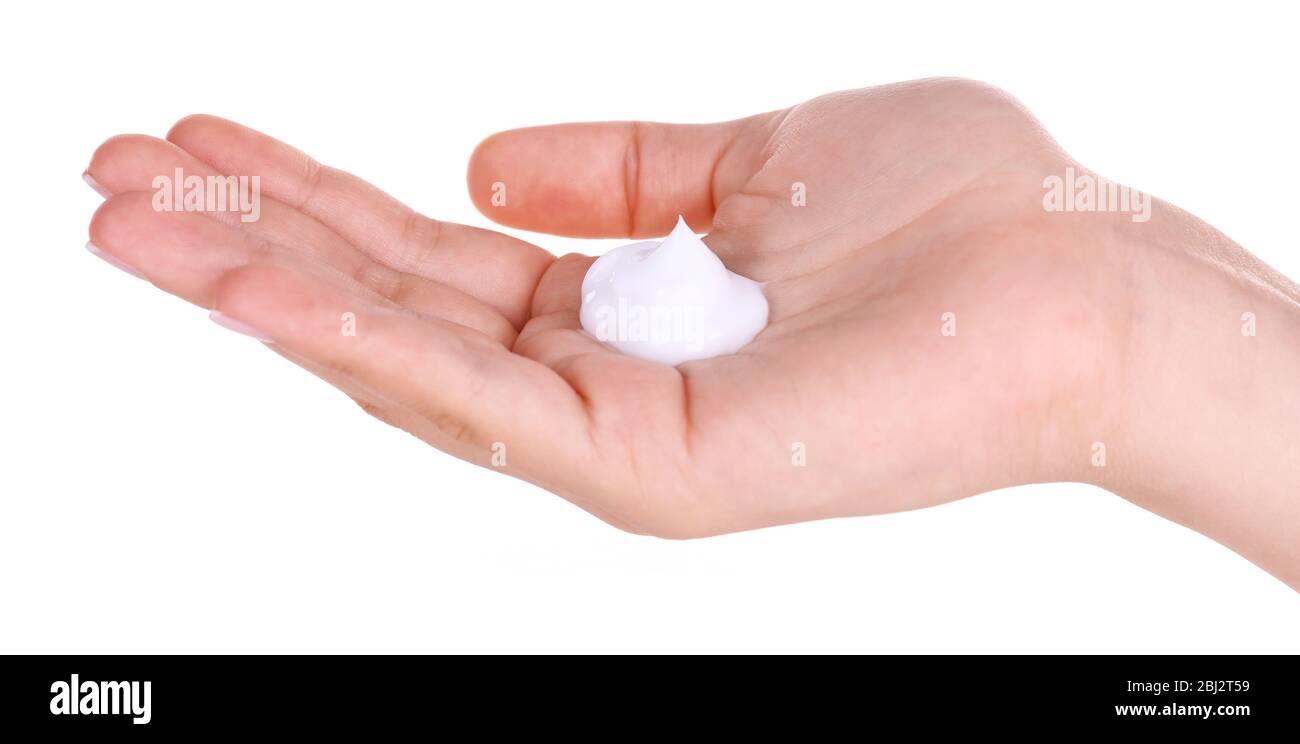 Cream on woman's hand isolated on white Stock Photo - Alamy