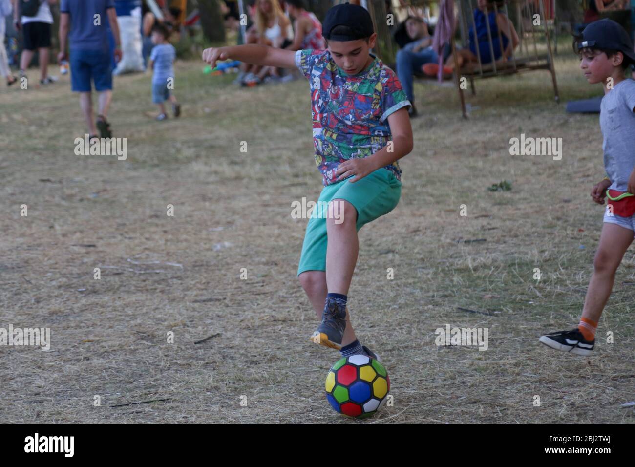 Audience with hands raised at a music festival and lights streaming ...