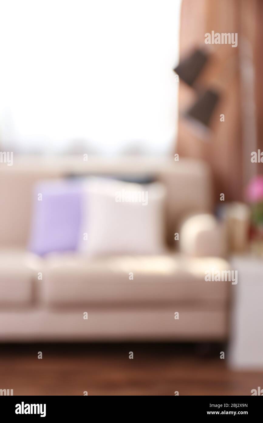 Blurred light living-room interior, close up Stock Photo - Alamy