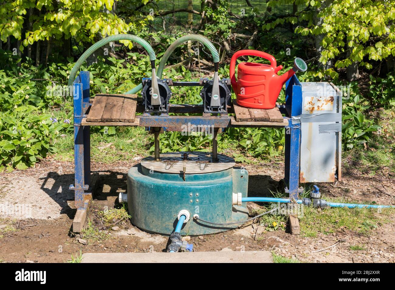 Electric pump for taking water from a natural well and used for ...