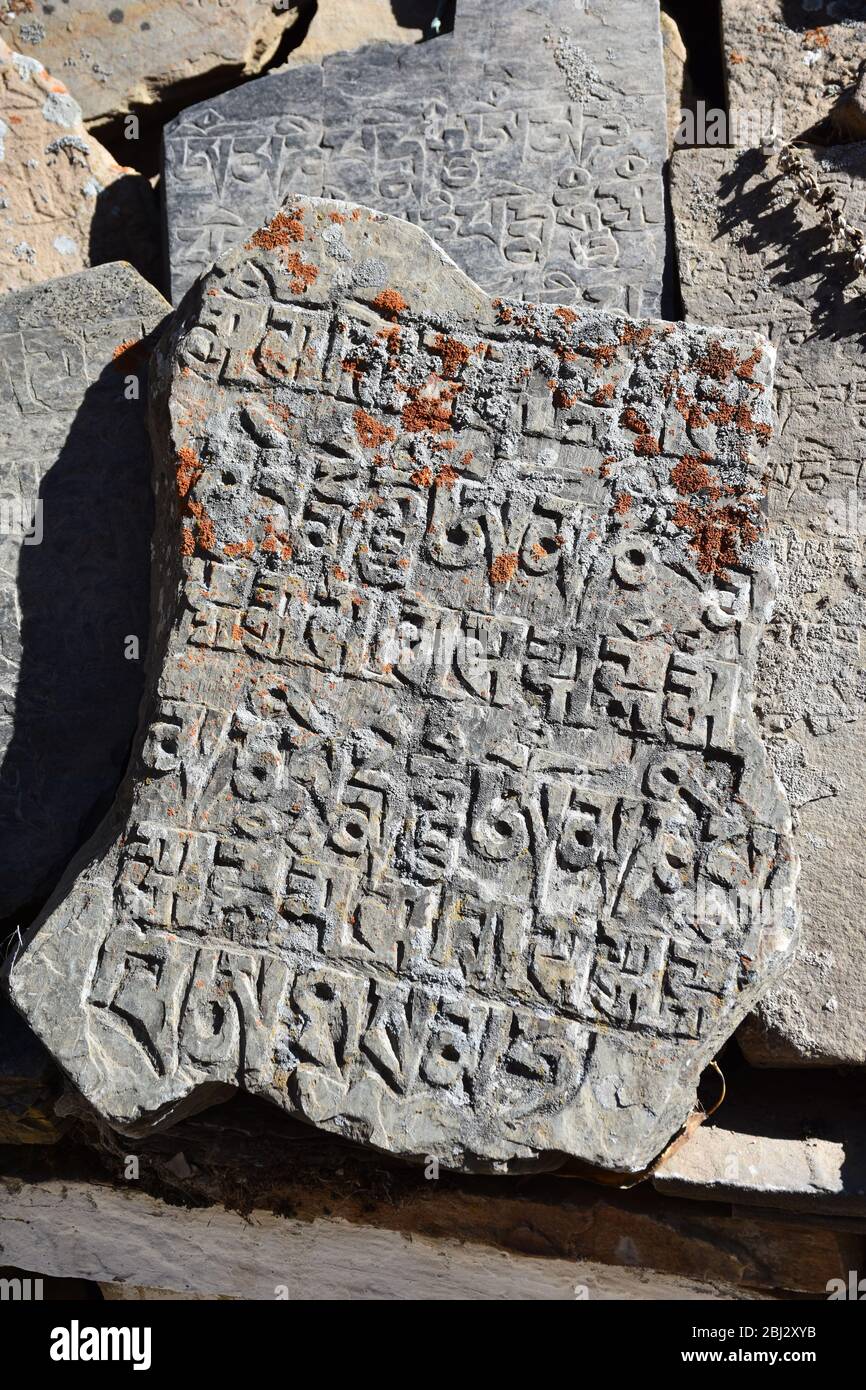 Buddhist prayers carved in stone hi-res stock photography and images ...