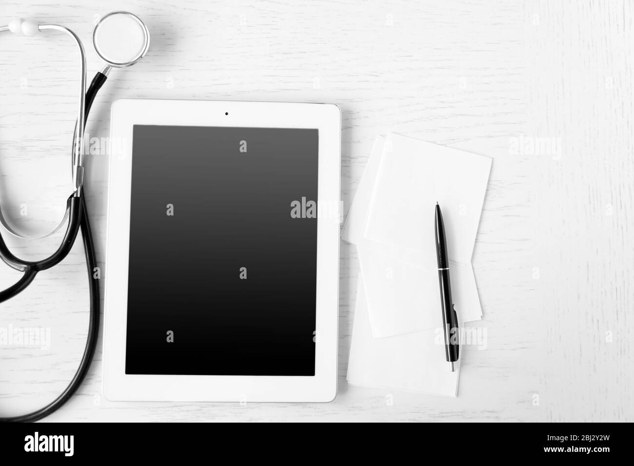 Laptop digital tablet on table Black and White Stock Photos & Images ...