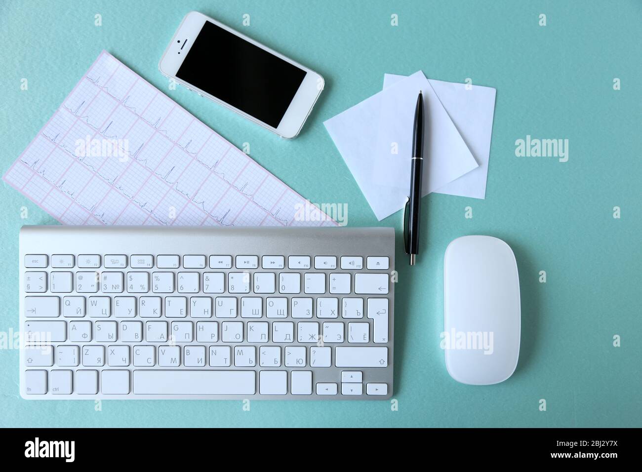 Medical still life with keyboard on blue table Stock Photo - Alamy