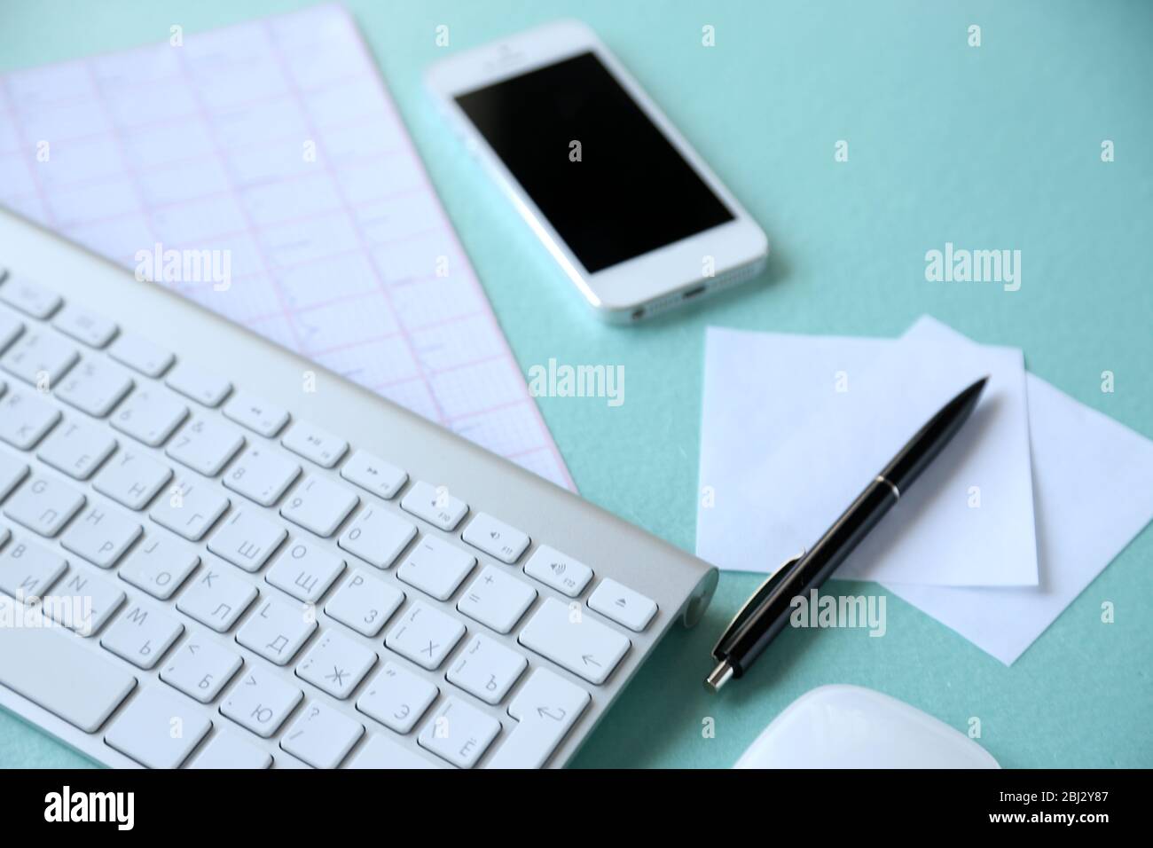 Medical still life with keyboard on blue table Stock Photo - Alamy