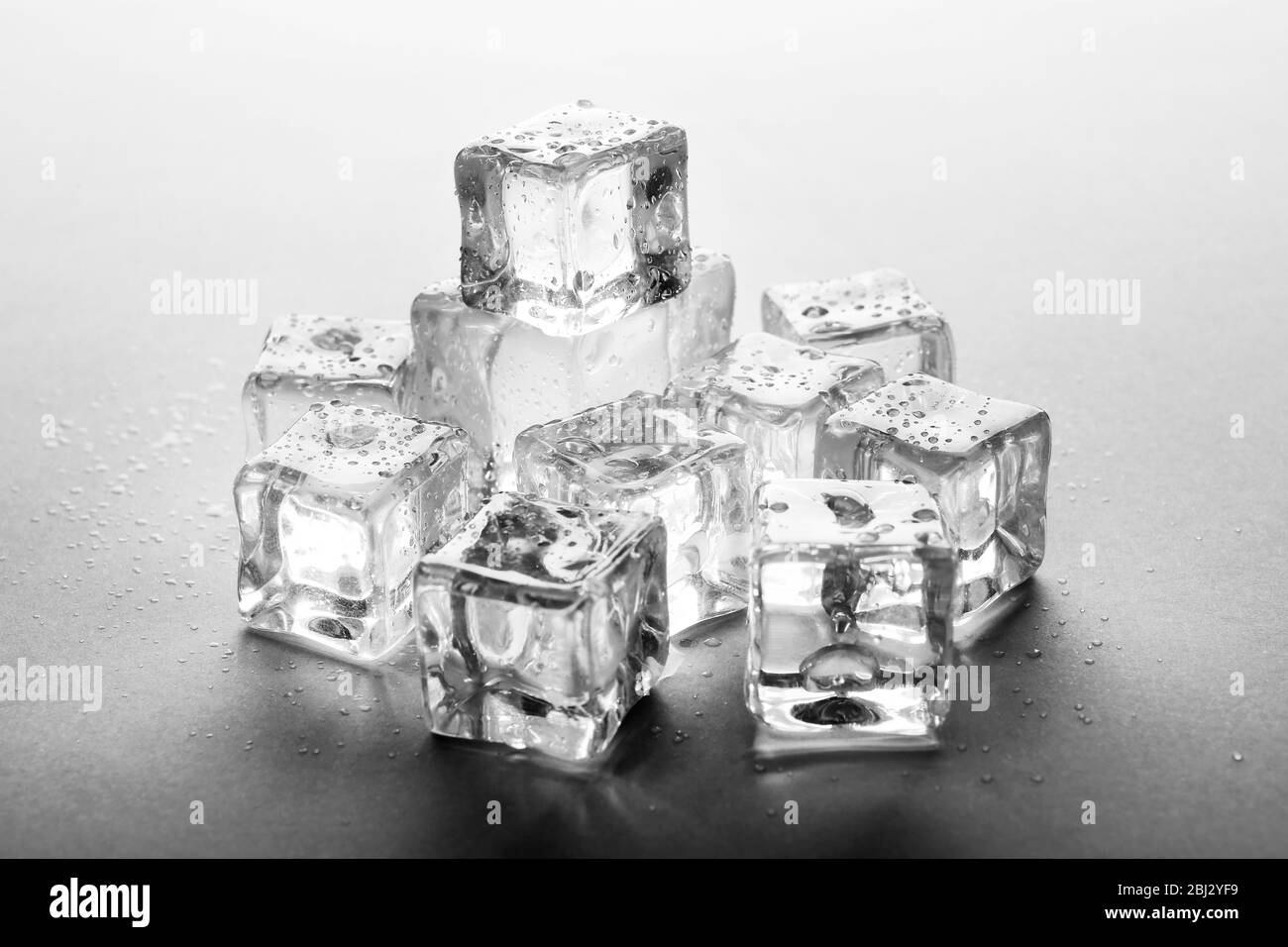 Perfect clear ice cubes on grey background Stock Photo - Alamy