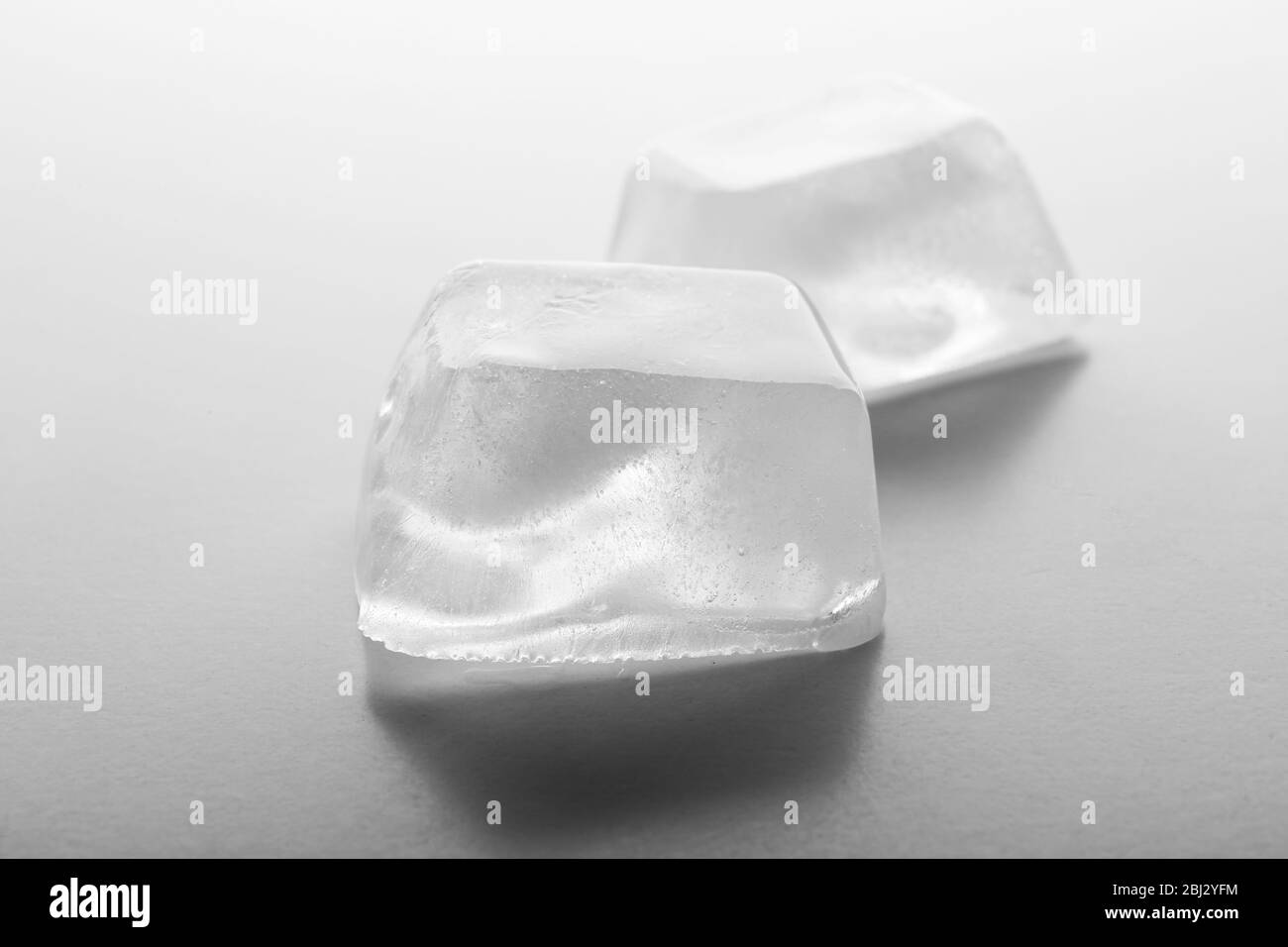 Matted ice cubes on light-grey background Stock Photo - Alamy