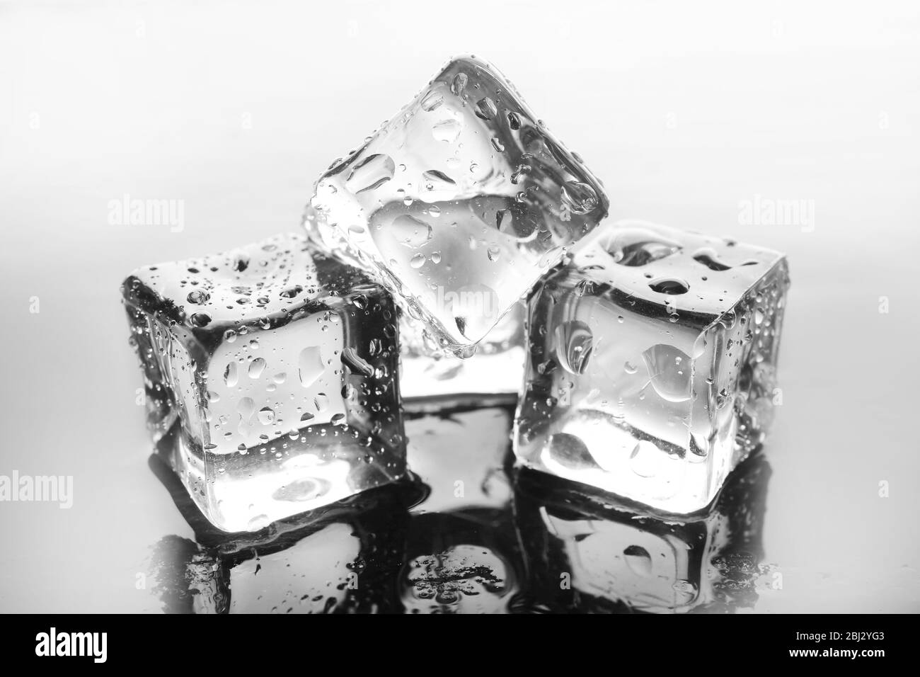 Shining ice cubes on liquid background Stock Photo - Alamy