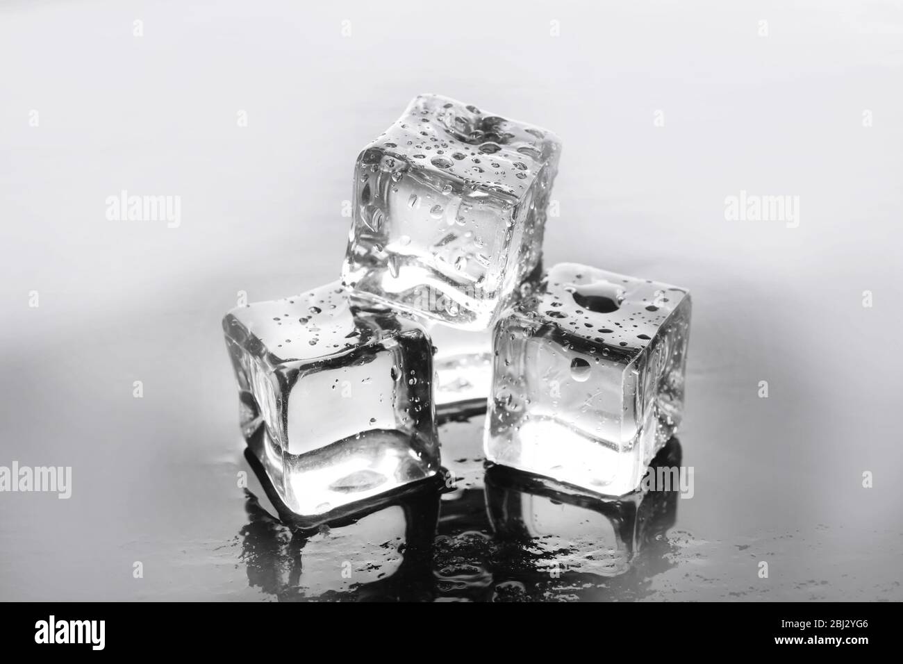Shining ice cubes on liquid background Stock Photo - Alamy