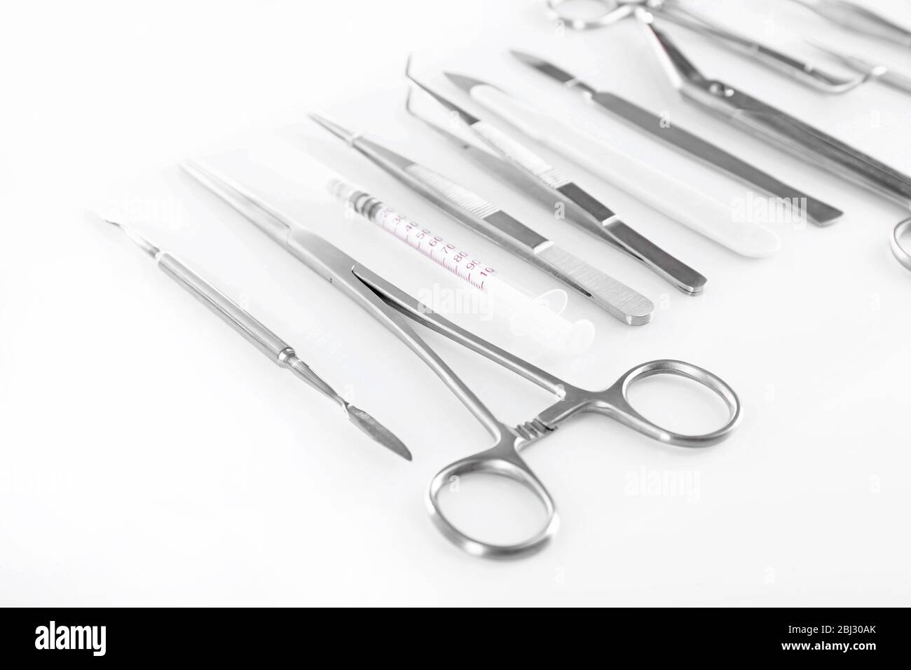 Surgery instruments isolated on white Stock Photo - Alamy