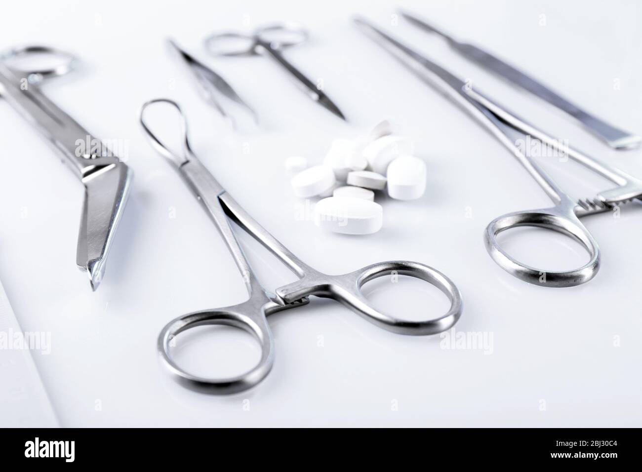 Surgery instruments isolated on white Stock Photo - Alamy