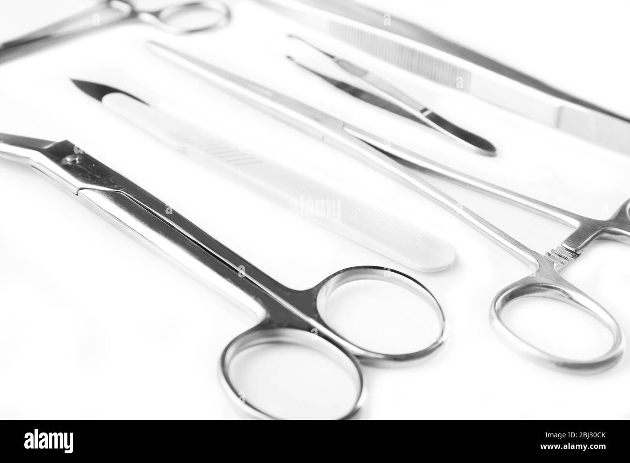 Surgery instruments isolated on white Stock Photo - Alamy