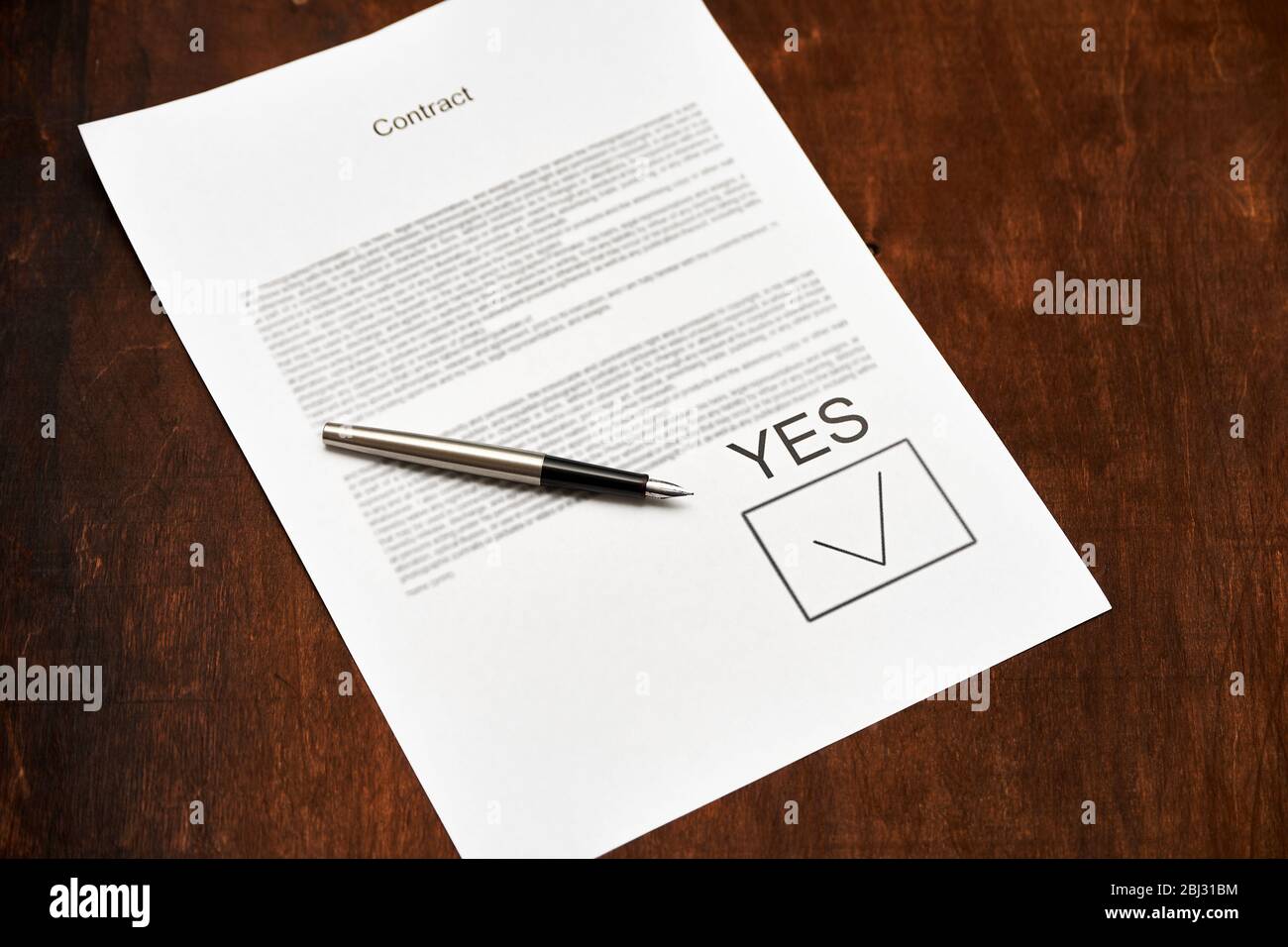 contract form with signature approval yes. ink pen lies on paper Stock ...