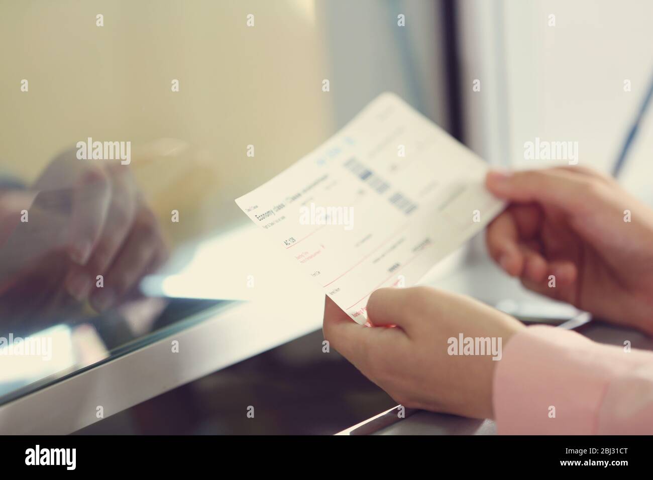 Airport Check-In Counters With Passengers Stock Photo - Alamy