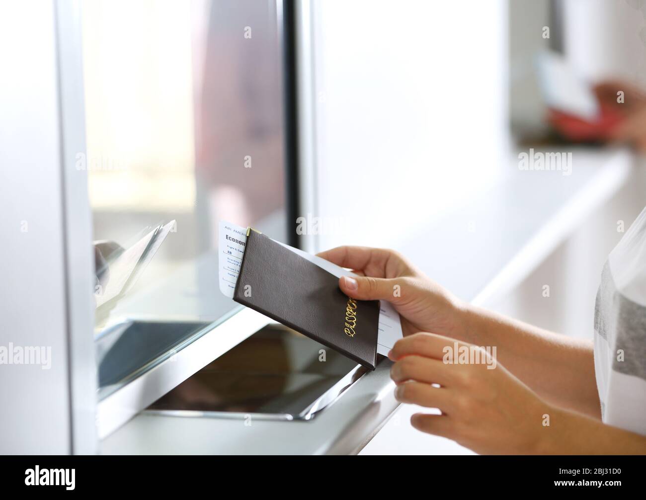 Airport Check-In Counters With Passengers Stock Photo - Alamy