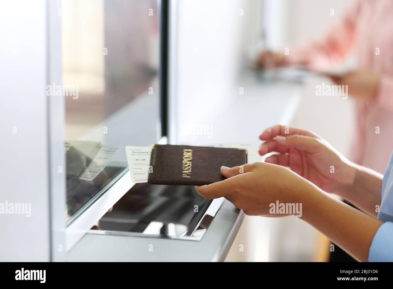 Airport Check-In Counters With Passengers Stock Photo - Alamy