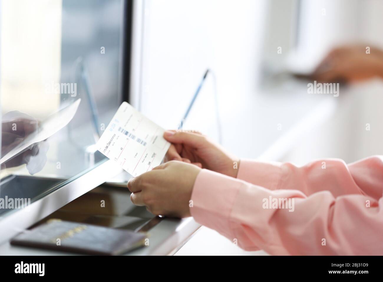 Airport Check-In Counters With Passengers Stock Photo - Alamy