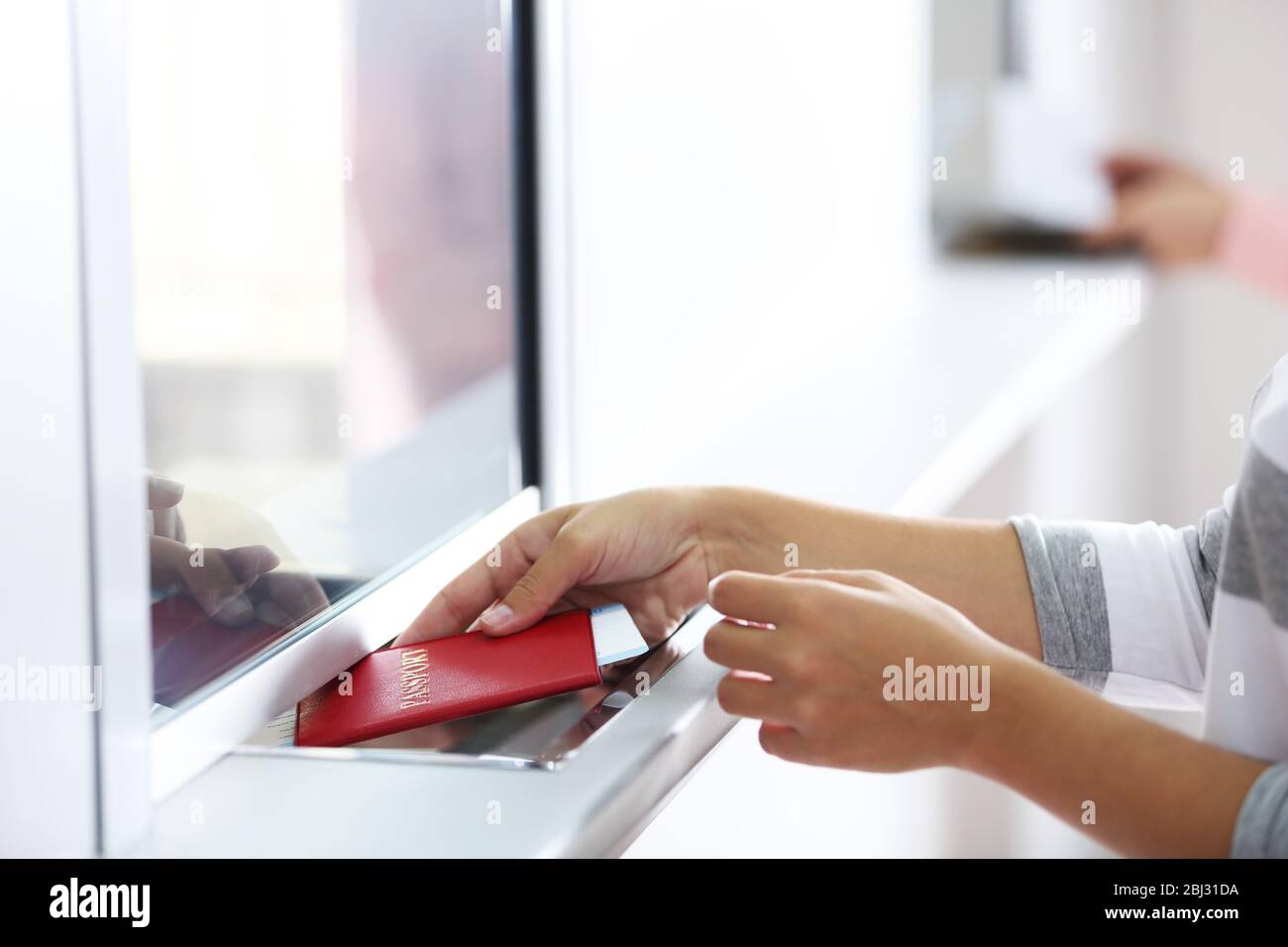 Airport Check-In Counters With Passengers Stock Photo - Alamy