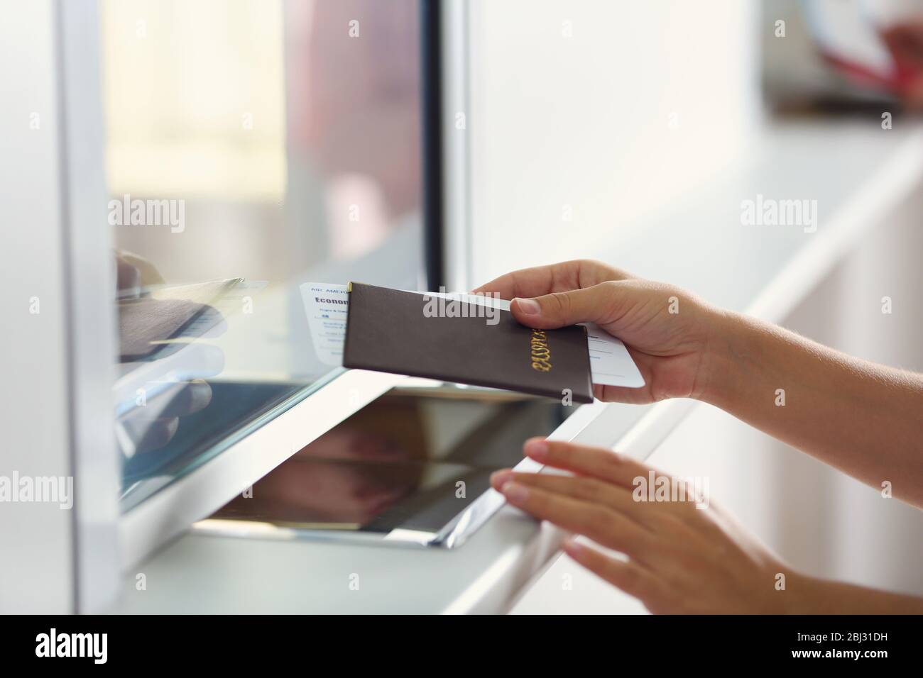 Airport Check-In Counters With Passengers Stock Photo - Alamy