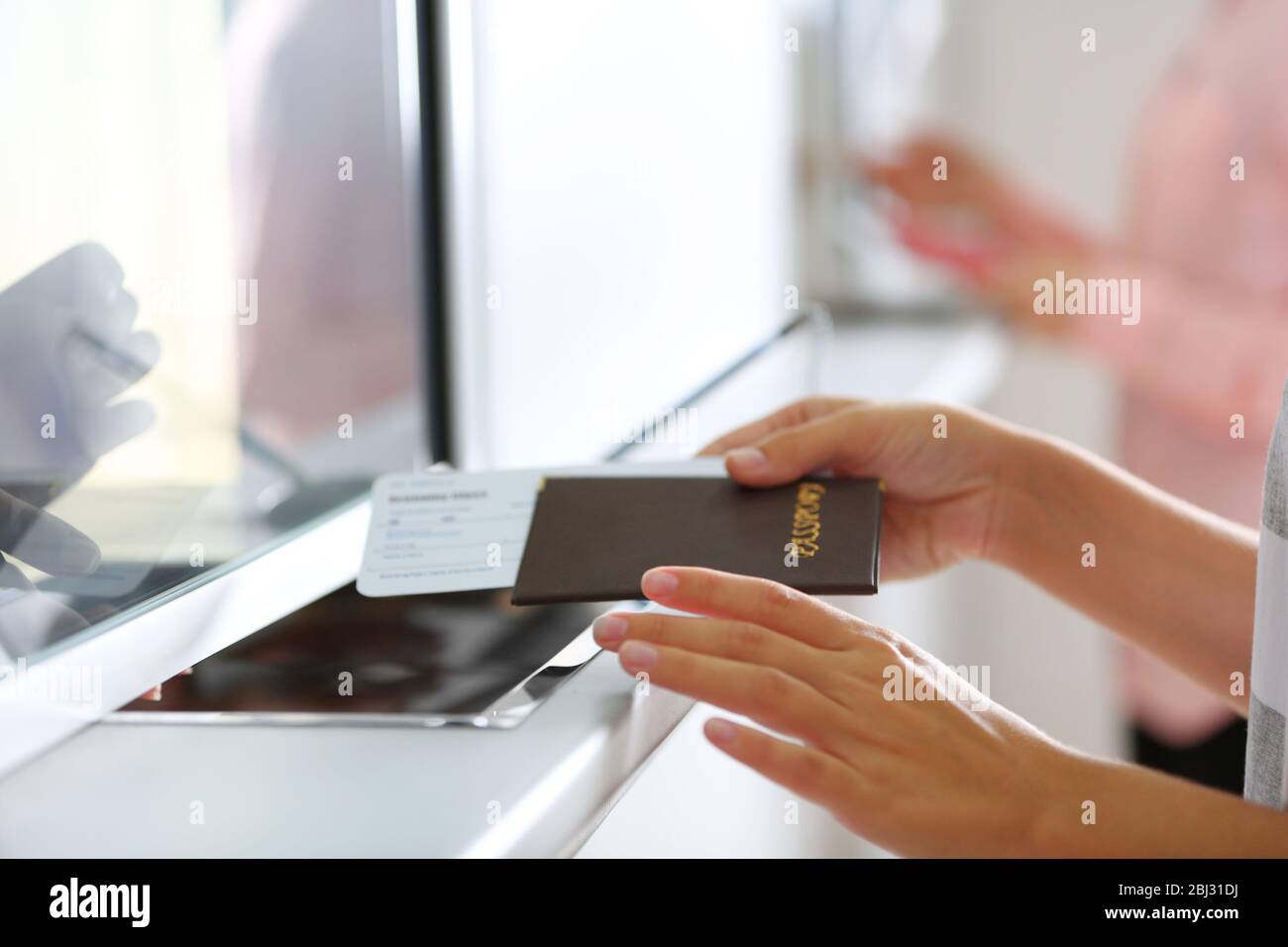 Airport Check-In Counters With Passengers Stock Photo - Alamy