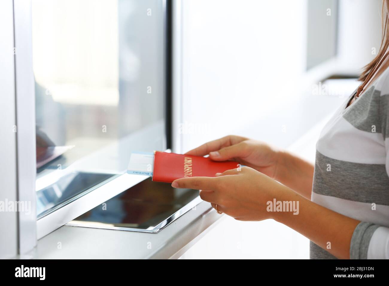 Airport Check-In Counters With Passengers Stock Photo - Alamy