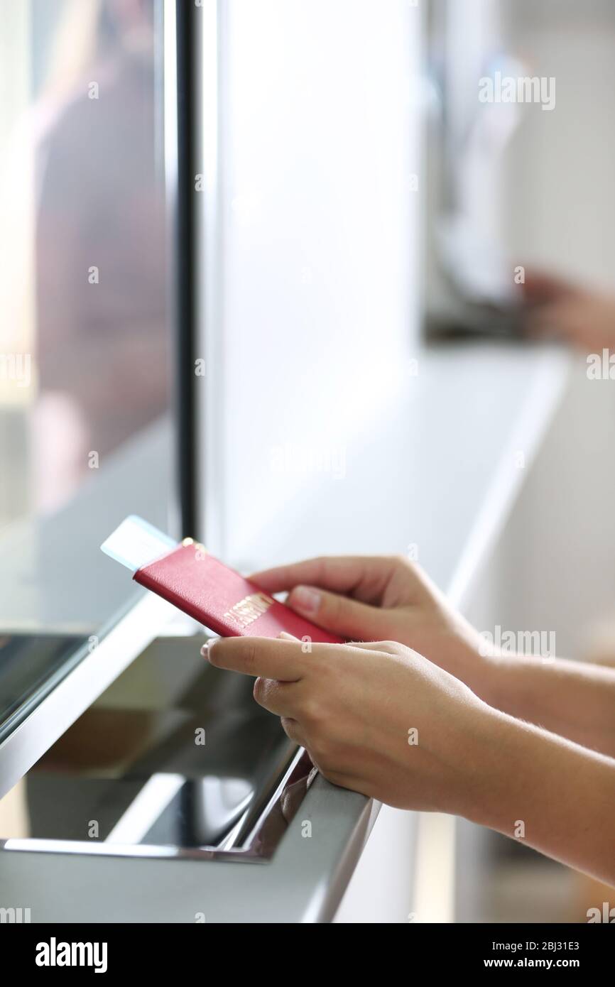 Airport Check-In Counters With Passengers Stock Photo - Alamy