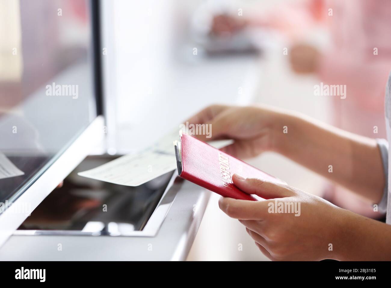 Airport Check-In Counters With Passengers Stock Photo - Alamy