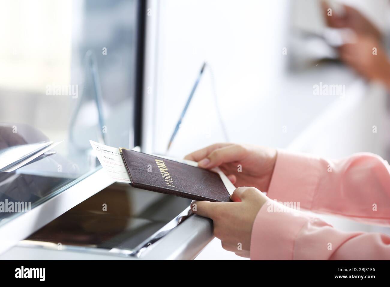 Airport Check-In Counters With Passengers Stock Photo - Alamy