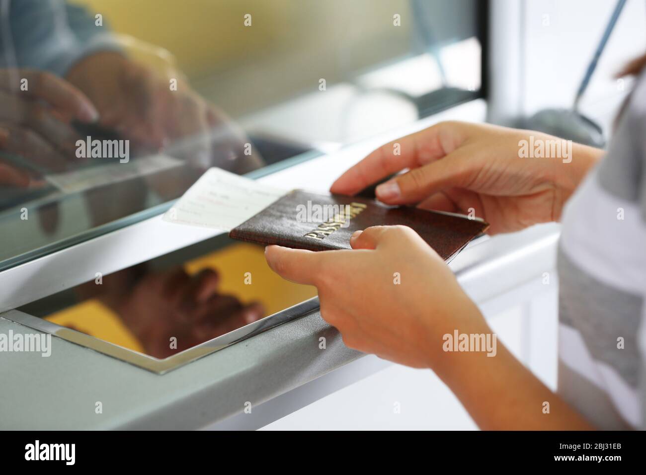 Airport Check-In Counters With Passengers Stock Photo - Alamy