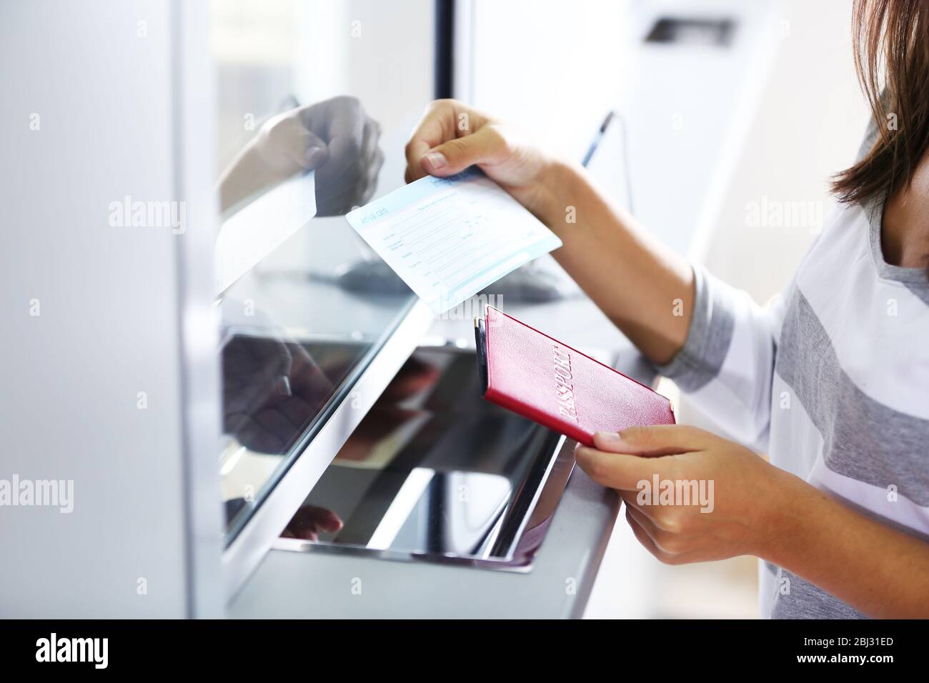 Airport Check-In Counters With Passengers Stock Photo - Alamy