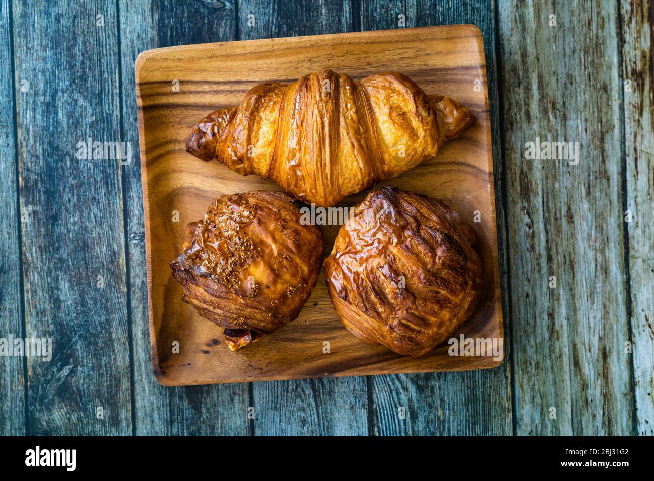 Assortment of Assorted Croissant Varieties om Wooden Plate / Variety of ...