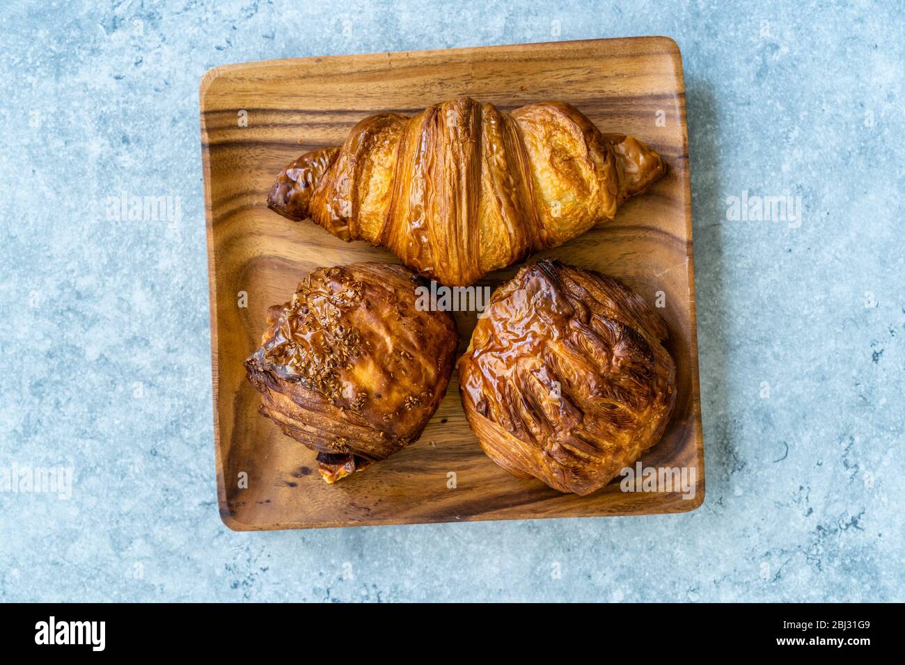 Assortment of Assorted Croissant Varieties om Wooden Plate / Variety of ...