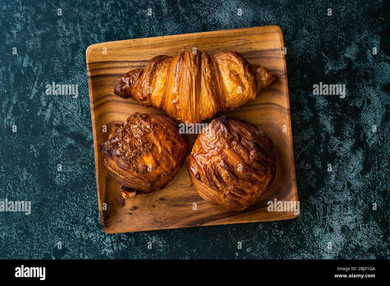 Assortment of Assorted Croissant Varieties om Wooden Plate / Variety of ...