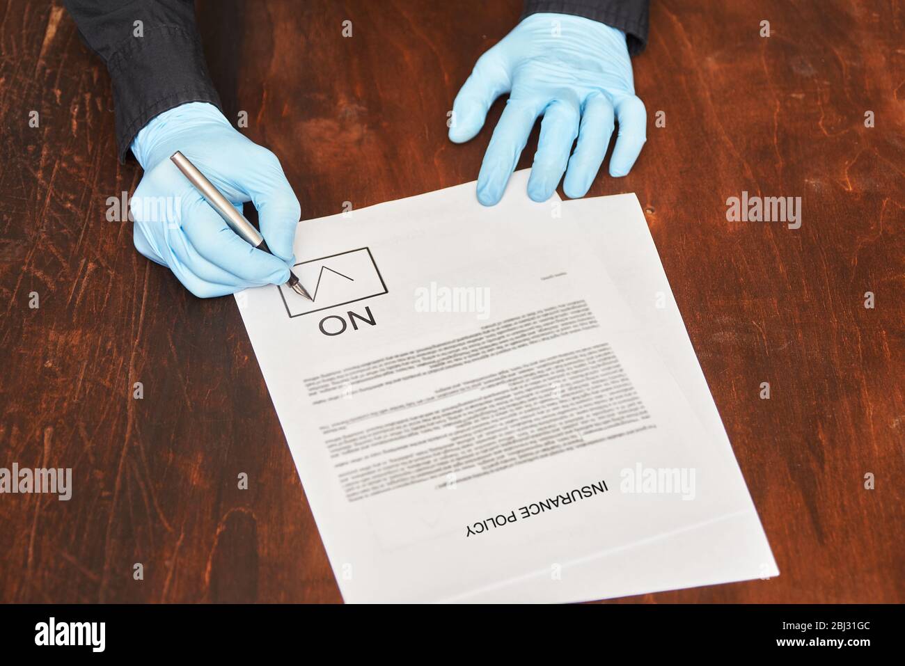 man in latex gloves signs a blank. mark not approved not agreed no ...
