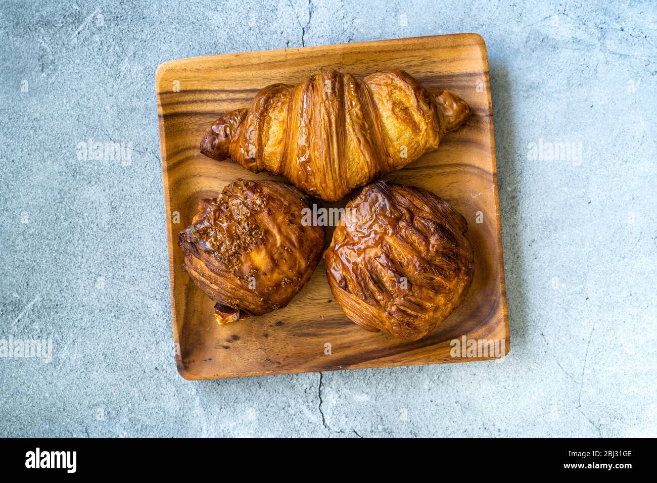 Assortment of Assorted Croissant Varieties om Wooden Plate / Variety of ...