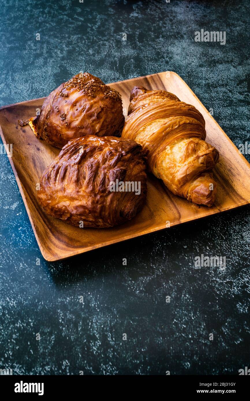 Assortment of Assorted Croissant Varieties om Wooden Plate / Variety of ...