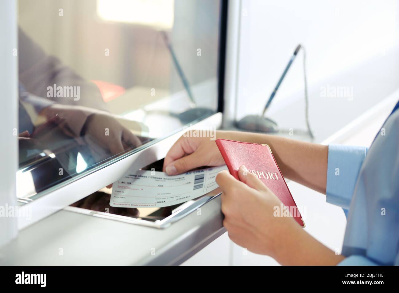 Airport Check-In Counters With Passengers Stock Photo - Alamy