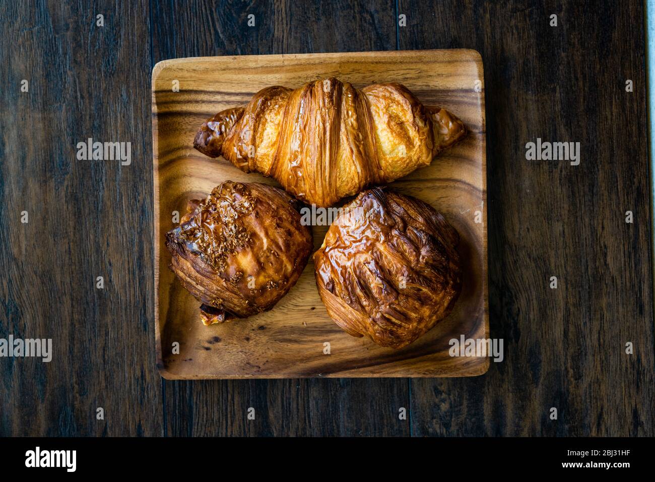Assortment of Assorted Croissant Varieties om Wooden Plate / Variety of ...