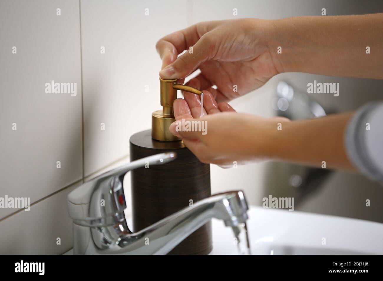 Washing of hands with soap under running water Stock Photo - Alamy