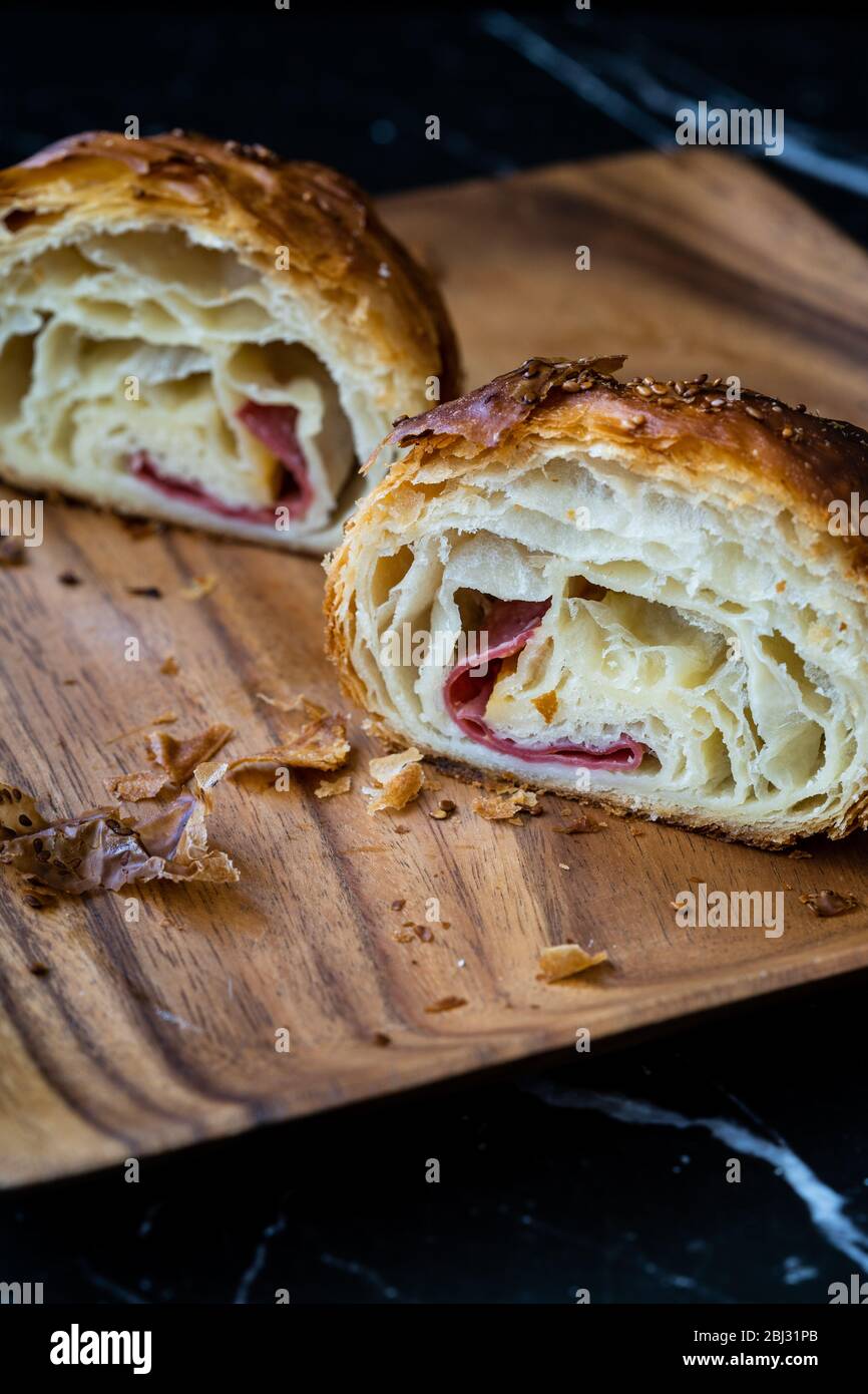 Freshly Baked Half Cut Two Pieces Croissant with Bacon and Cheddar so ...
