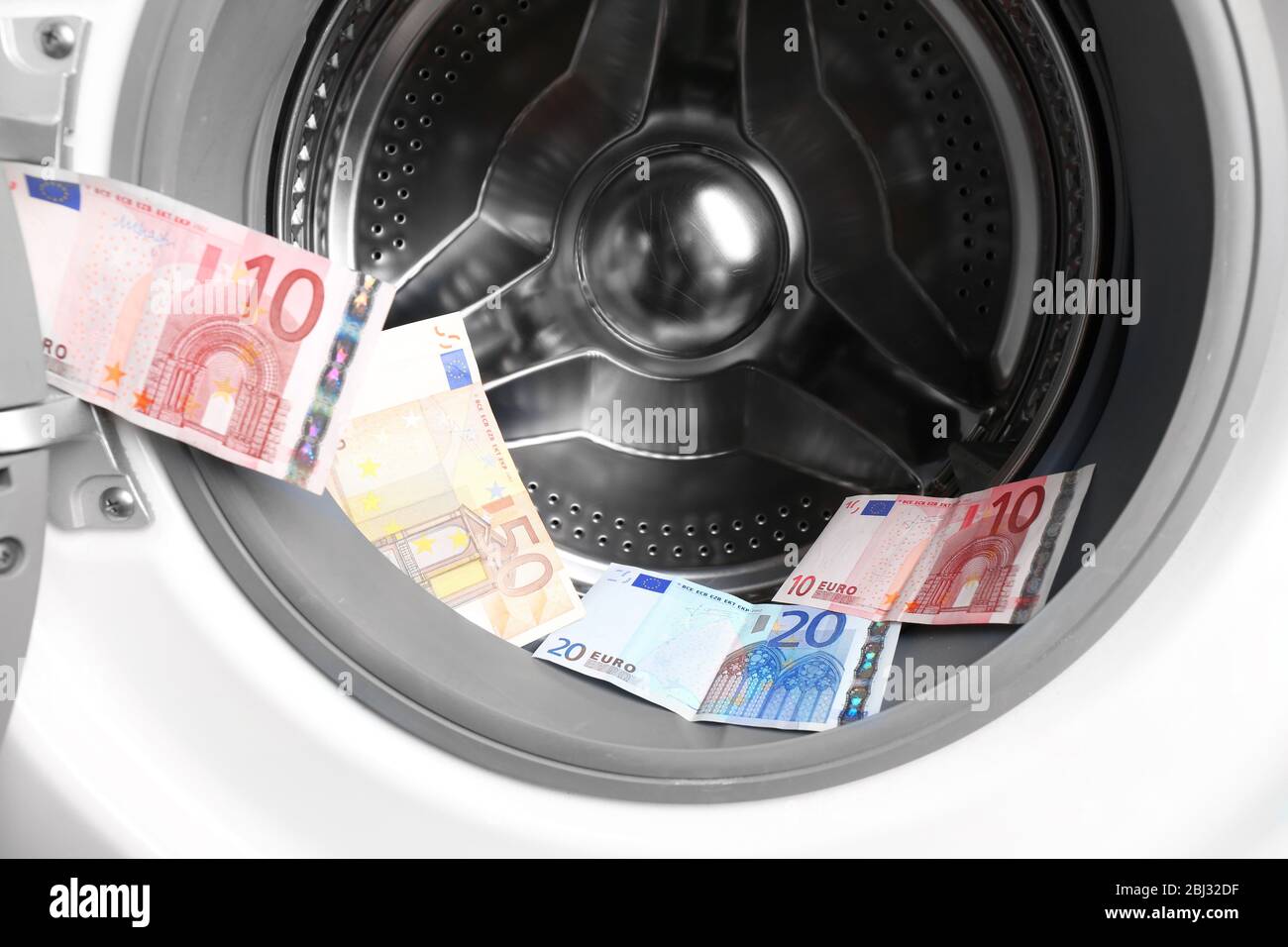 Money in washing machine, close up Stock Photo - Alamy