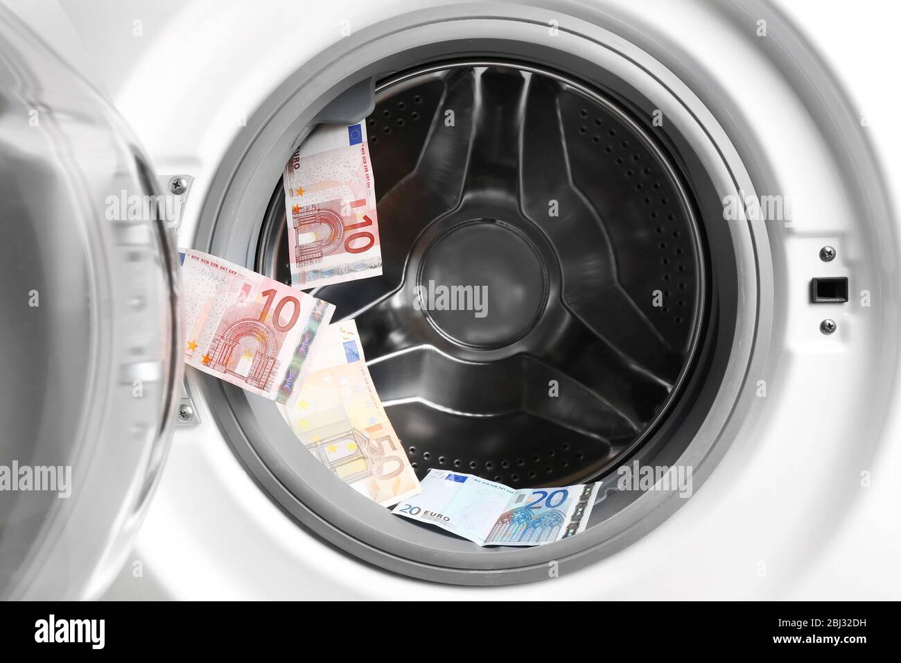 Money in washing machine, close up Stock Photo - Alamy