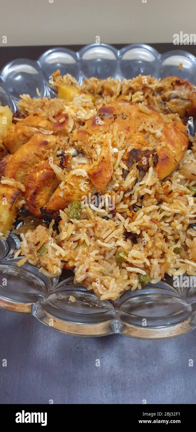 Roasted whole chicken with stuffed rice and potato Stock Photo - Alamy