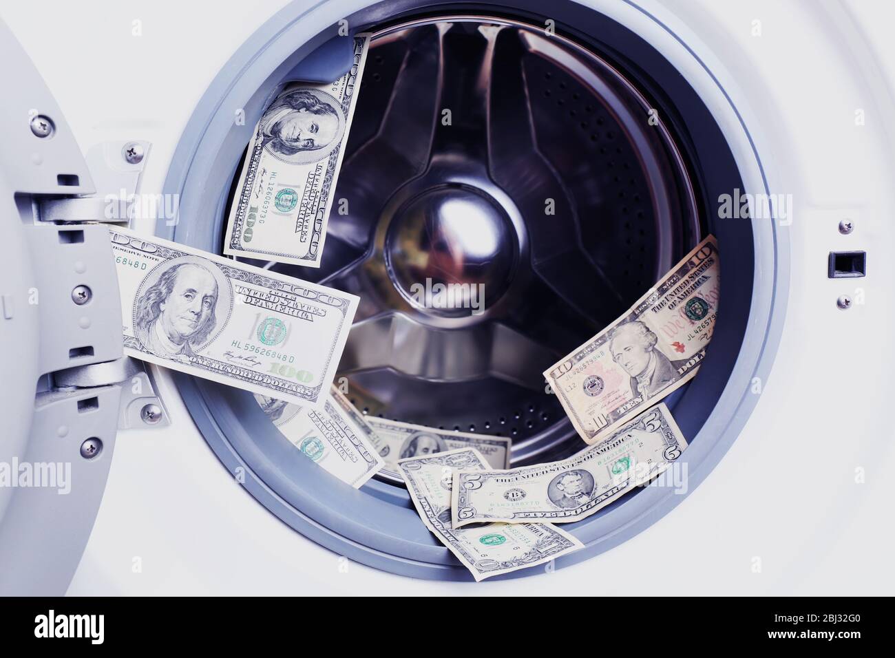 Money in washing machine, close up Stock Photo - Alamy