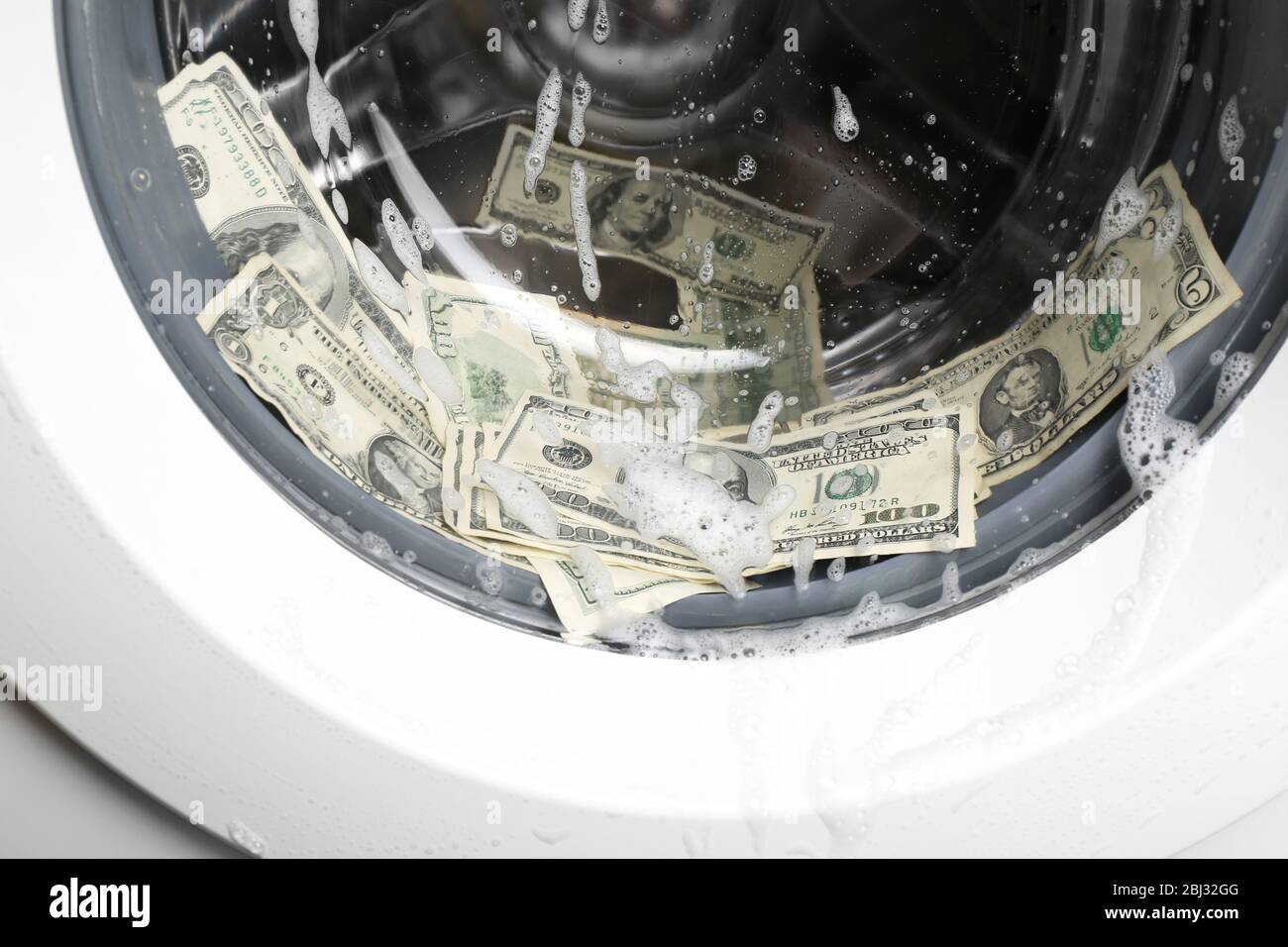Money laundering in washing machine hi-res stock photography and images ...