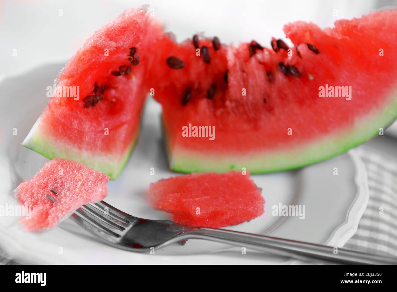 Sliced watermelon on plate closeup Stock Photo - Alamy